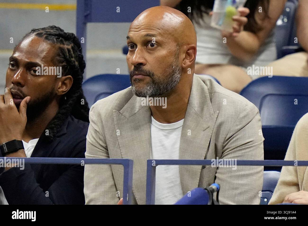 Keegan-Michael Key watches Jannik Sinner, of Italy, and Felix Auger ...