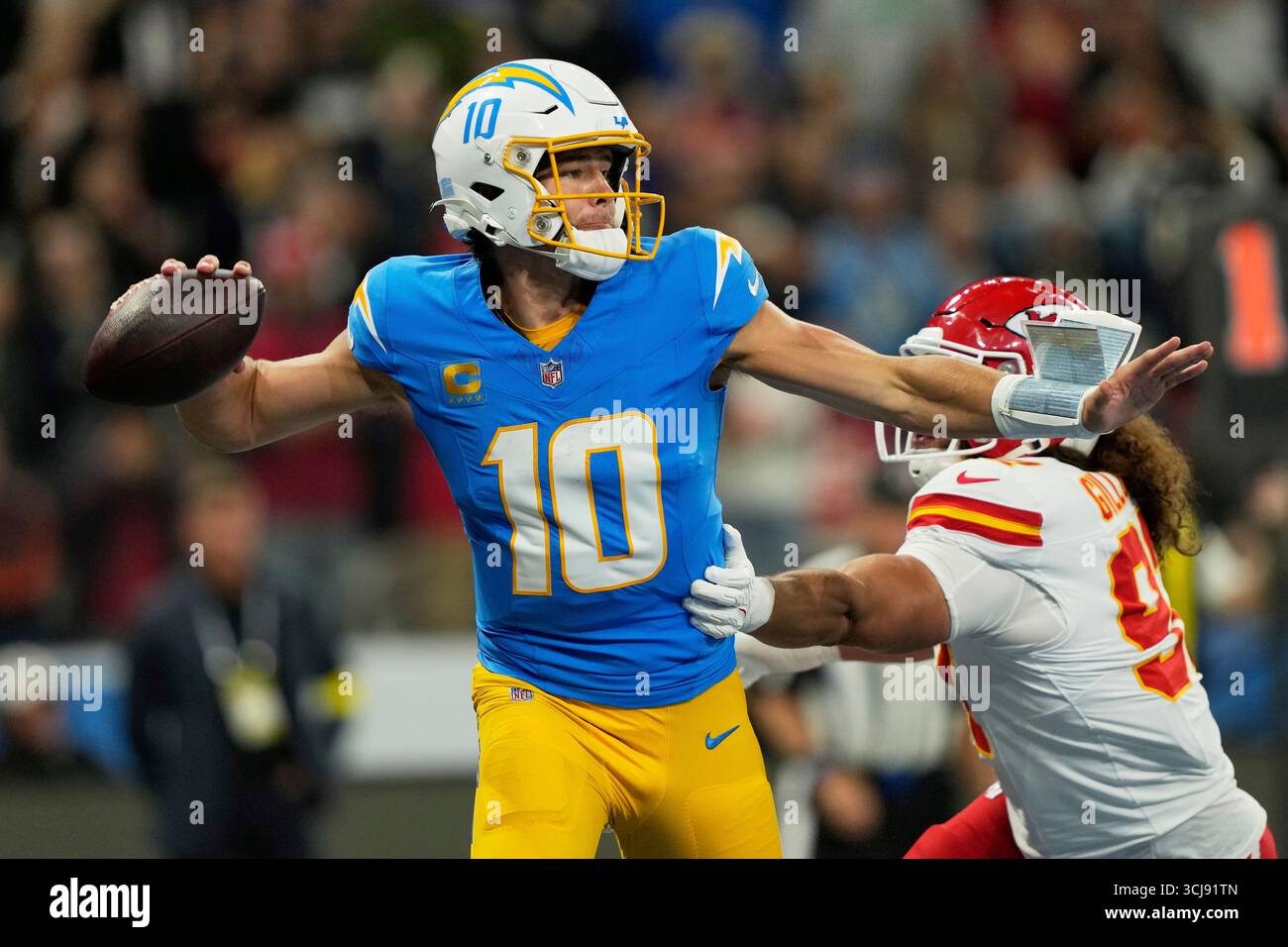 Kansas City Chiefs running back Isiah Pacheco passes under pressure ...