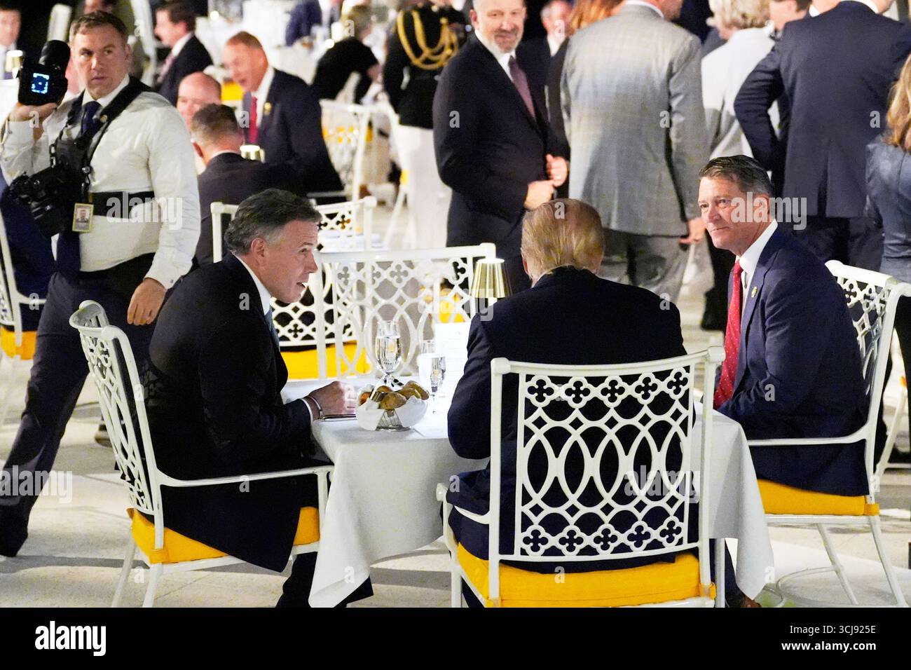 President Donald Trump sits with Sen. Dave McCormick, R-Pa., left, and ...