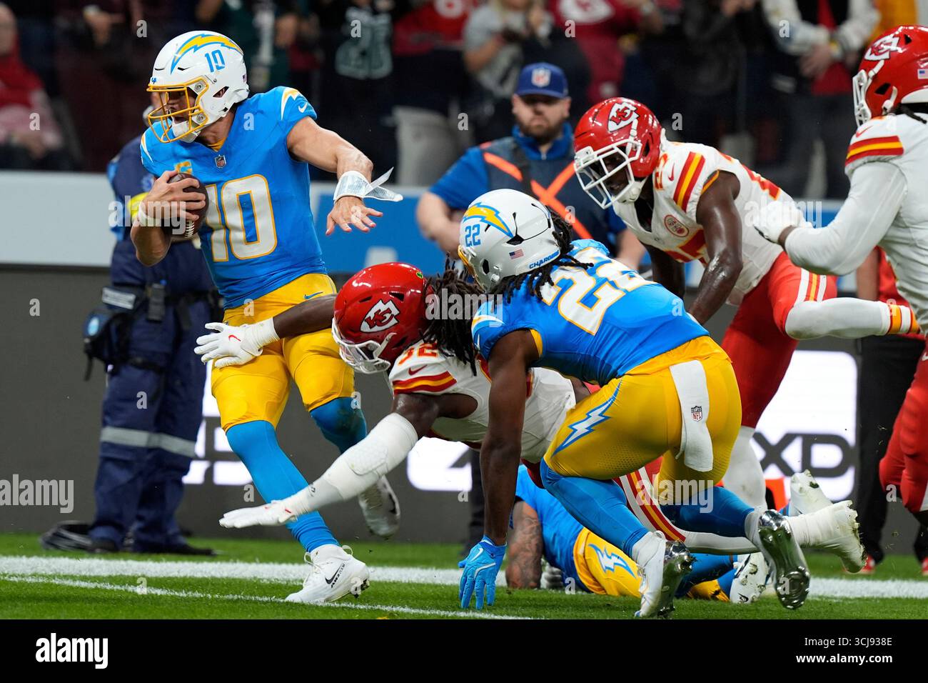 Los Angeles Chargers quarterback Justin Herbert runs against the Kansas ...