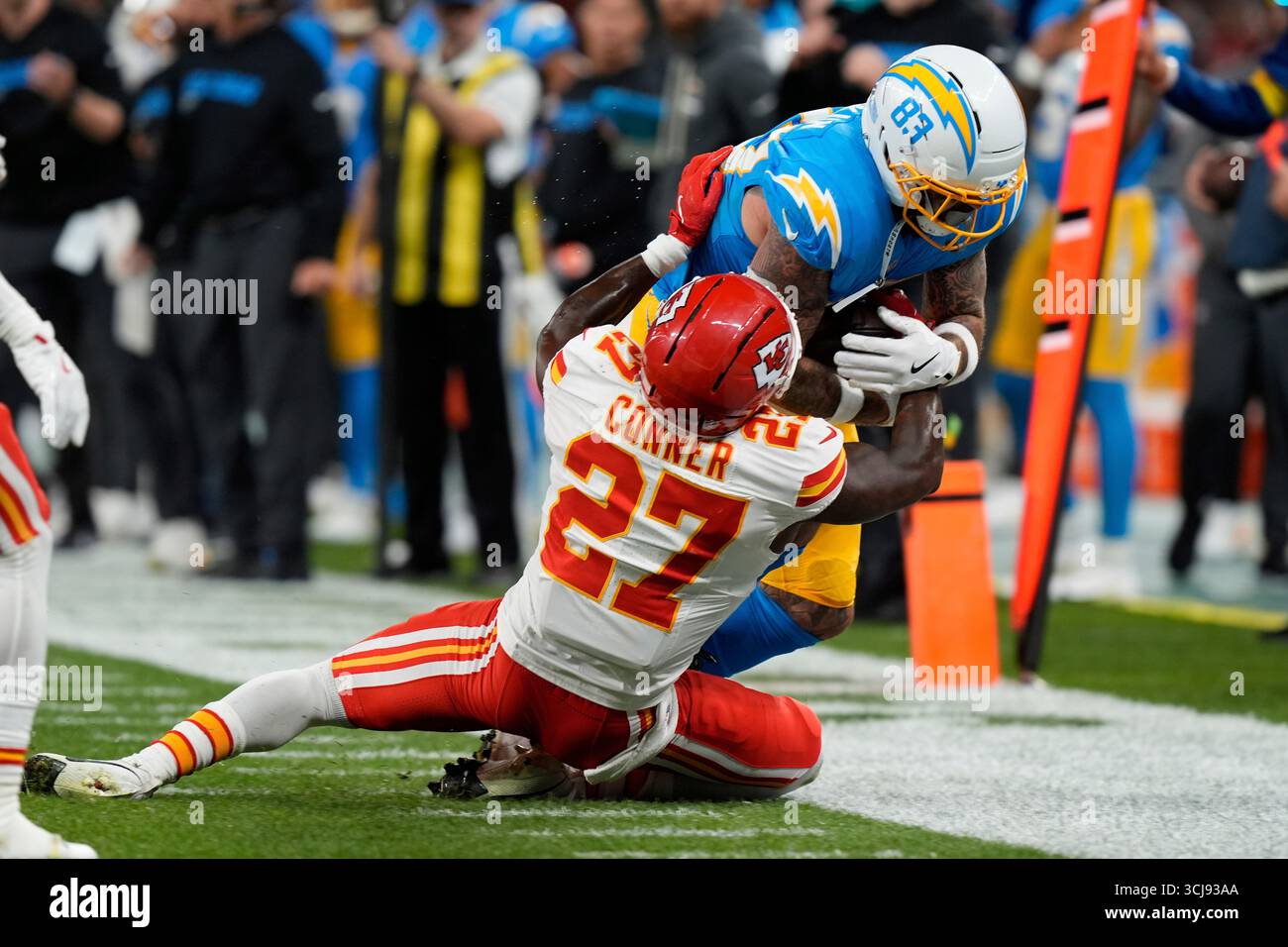 Los Angeles Chargers tight end Tyler Conklin is tackled by Kansas City ...