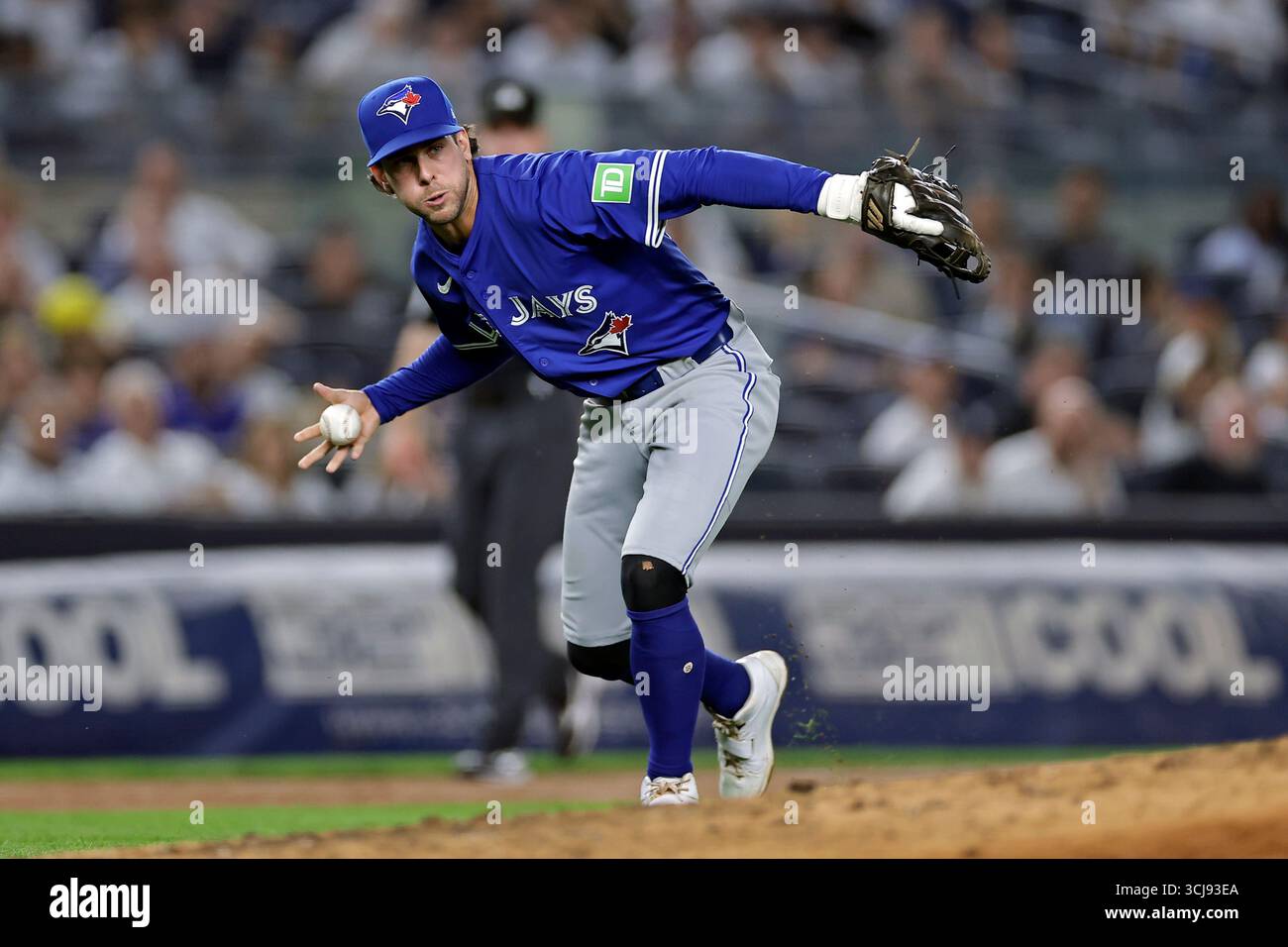 Toronto Blue Jays third baseman Ernie Clement throws out New York ...