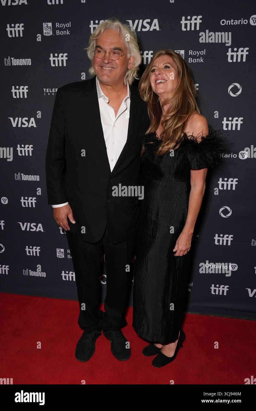 Director Paul Greengrass, left, and Joanna Kaye attend the premiere of ...