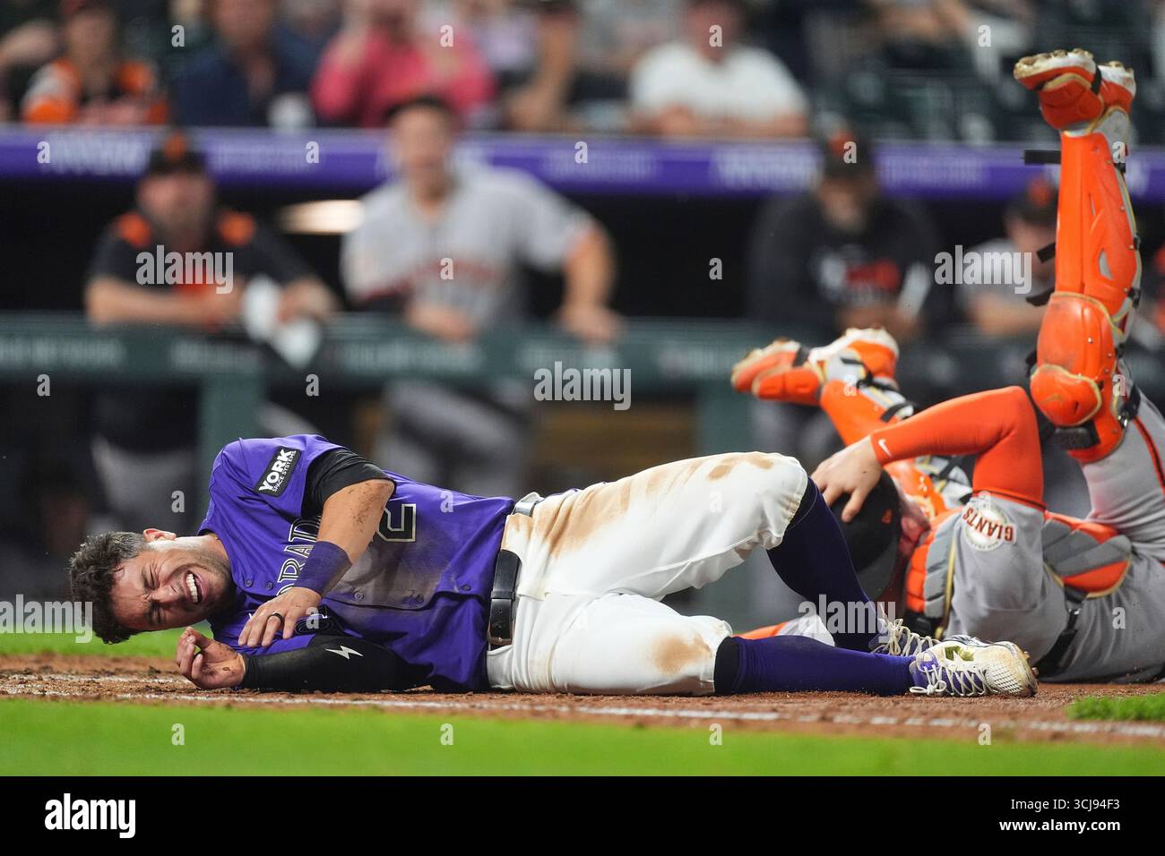 Colorado Rockies right fielder Tyler Freeman (2) reacts after colliding ...