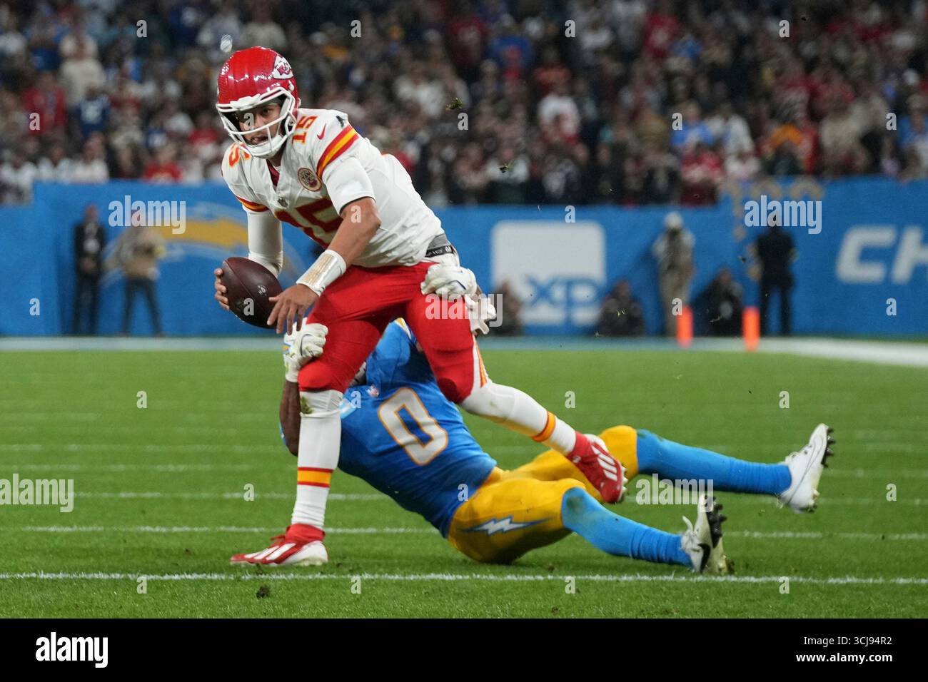 Kansas City Chiefs quarterback Patrick Mahomes is tackled by Los ...