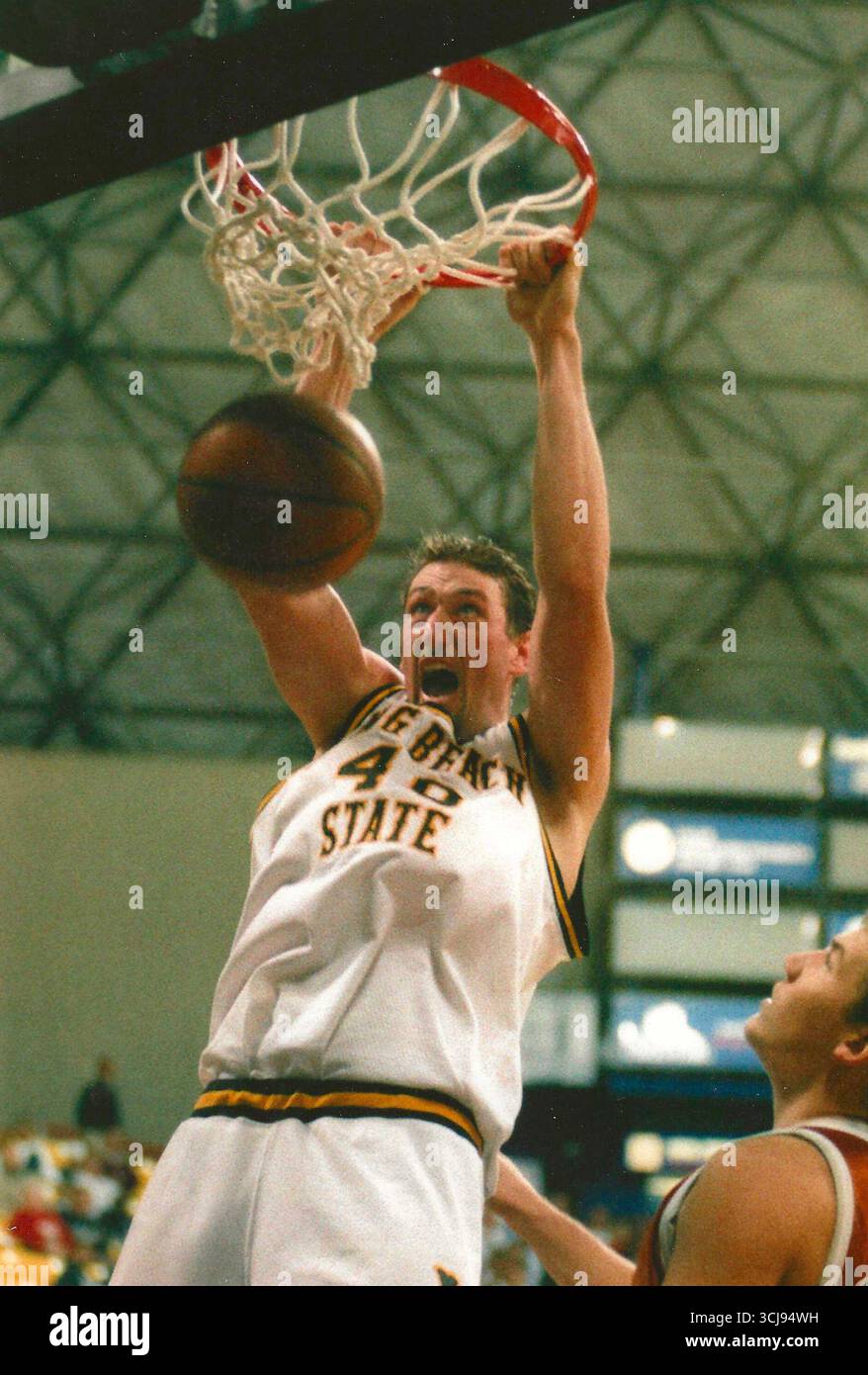 Joe McNaul of Long Beach State dunks the ball against Montana, Thursday ...