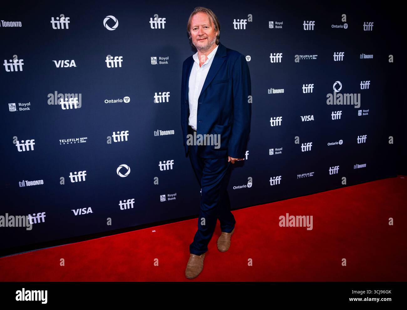 Director David Mackenzie walks the red carpet at the premiere of "Fuze ...