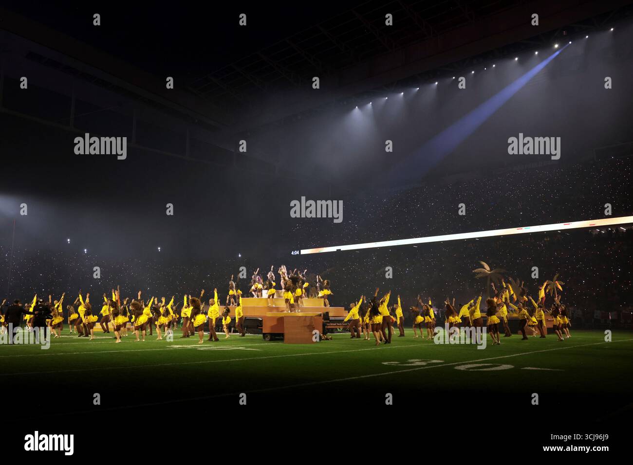 KAROL G performs during halftime at an NFL football game between the ...