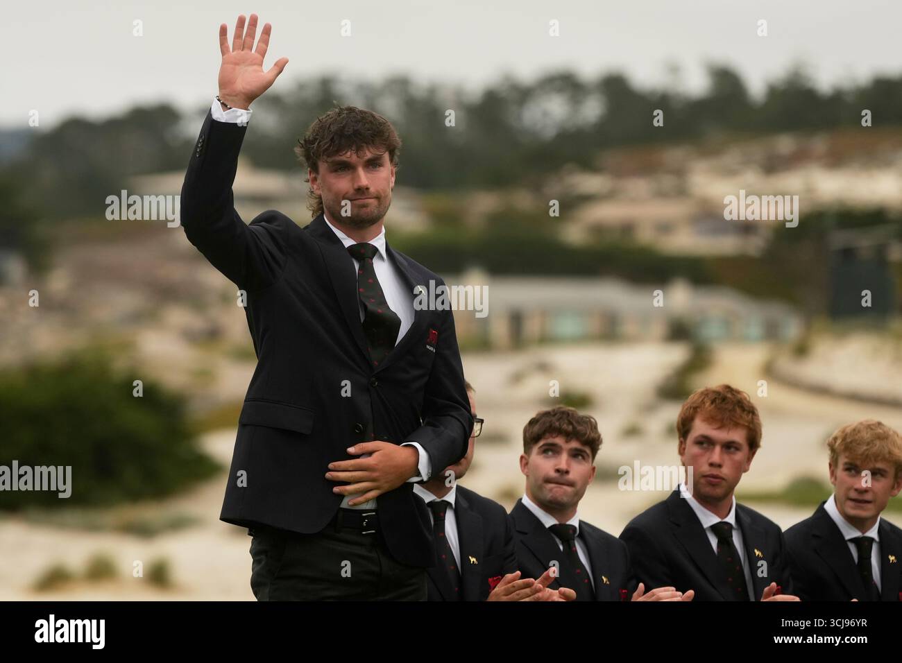 The Great Britain and Ireland team's Cameron Adam waves during the opening ceremony for the ...