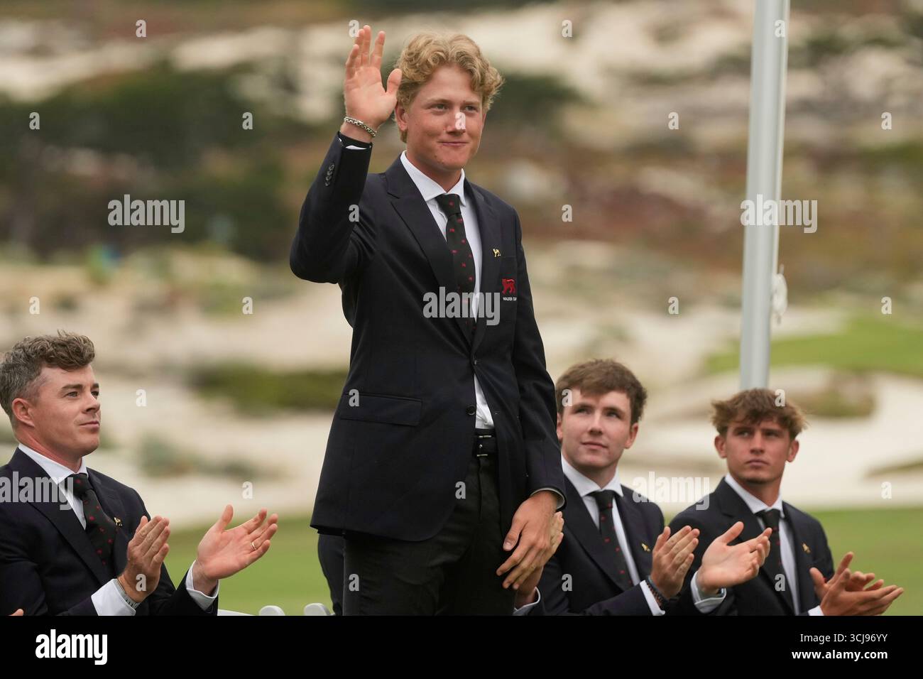 The Great Britain and Ireland team's Luke Poulter waves during the ...