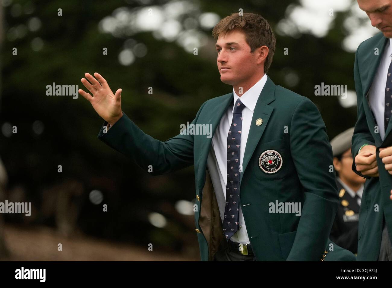 The USA team's Preston Stout waves during the opening ceremony for the ...