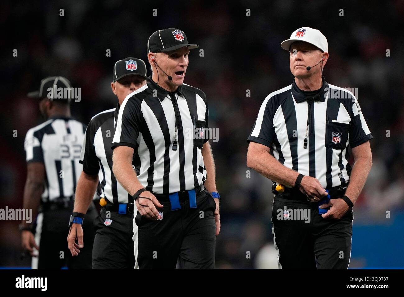 Referee Carl Cheffers, right, and his crew work an NFL game between the Los Angeles Chargers and ...