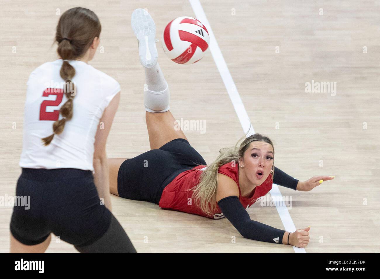 Nebraska's Laney Choboy, right, digs the ball during an NCAA college ...