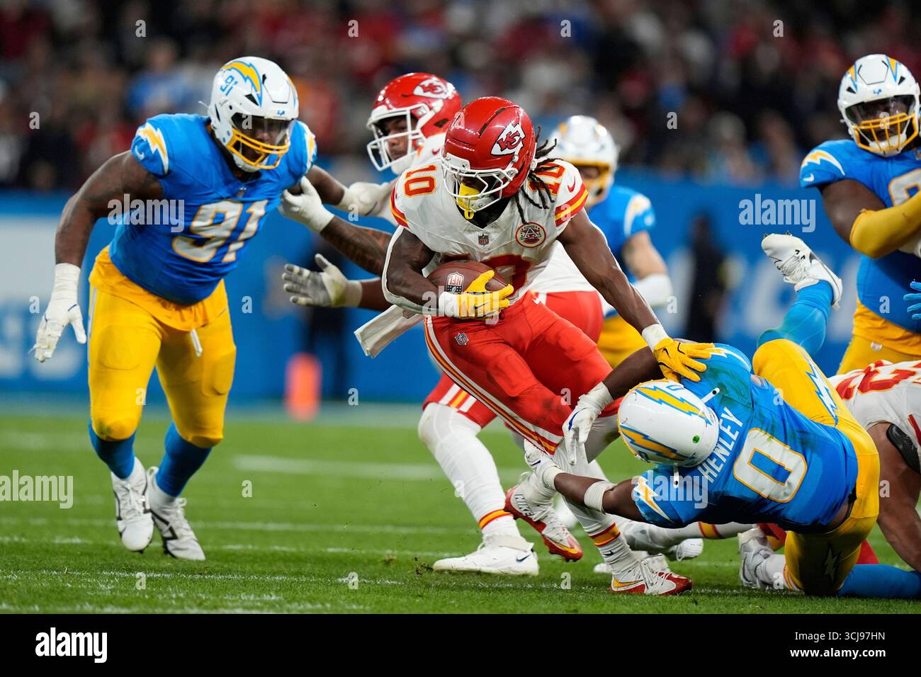 Kansas City Chiefs running back Isiah Pacheco is tackled by Los Angeles ...