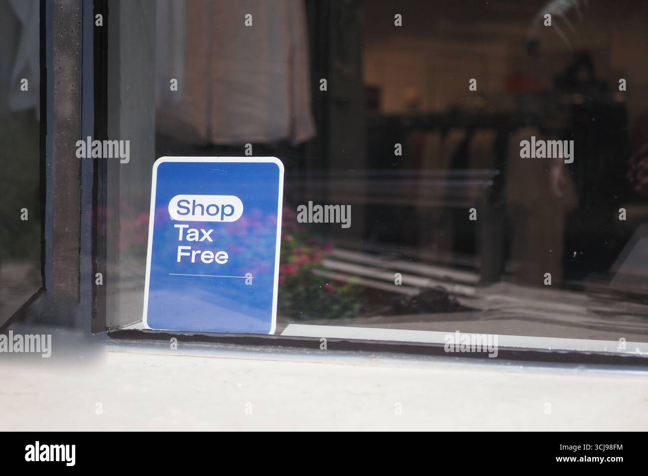 Sign promotes tax-free shopping at local retail store Stock Photo - Alamy