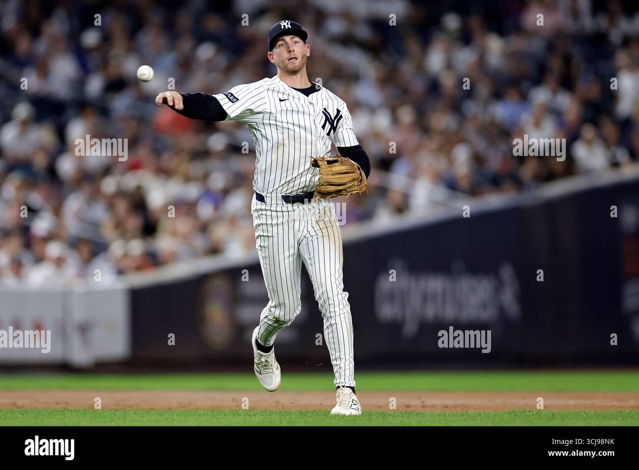 New York Yankees third baseman Ryan McMahon (19) throws during the ...