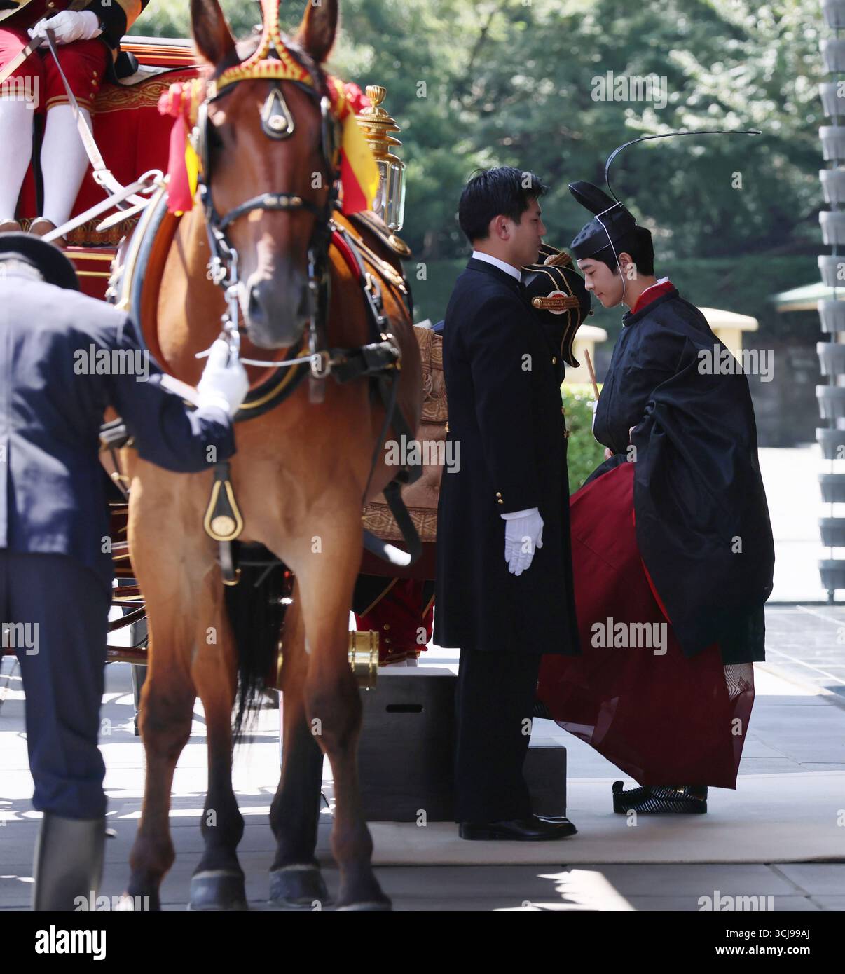 Prince Hisahiro rides in the ceremonial horse-drawn carriage during his ...