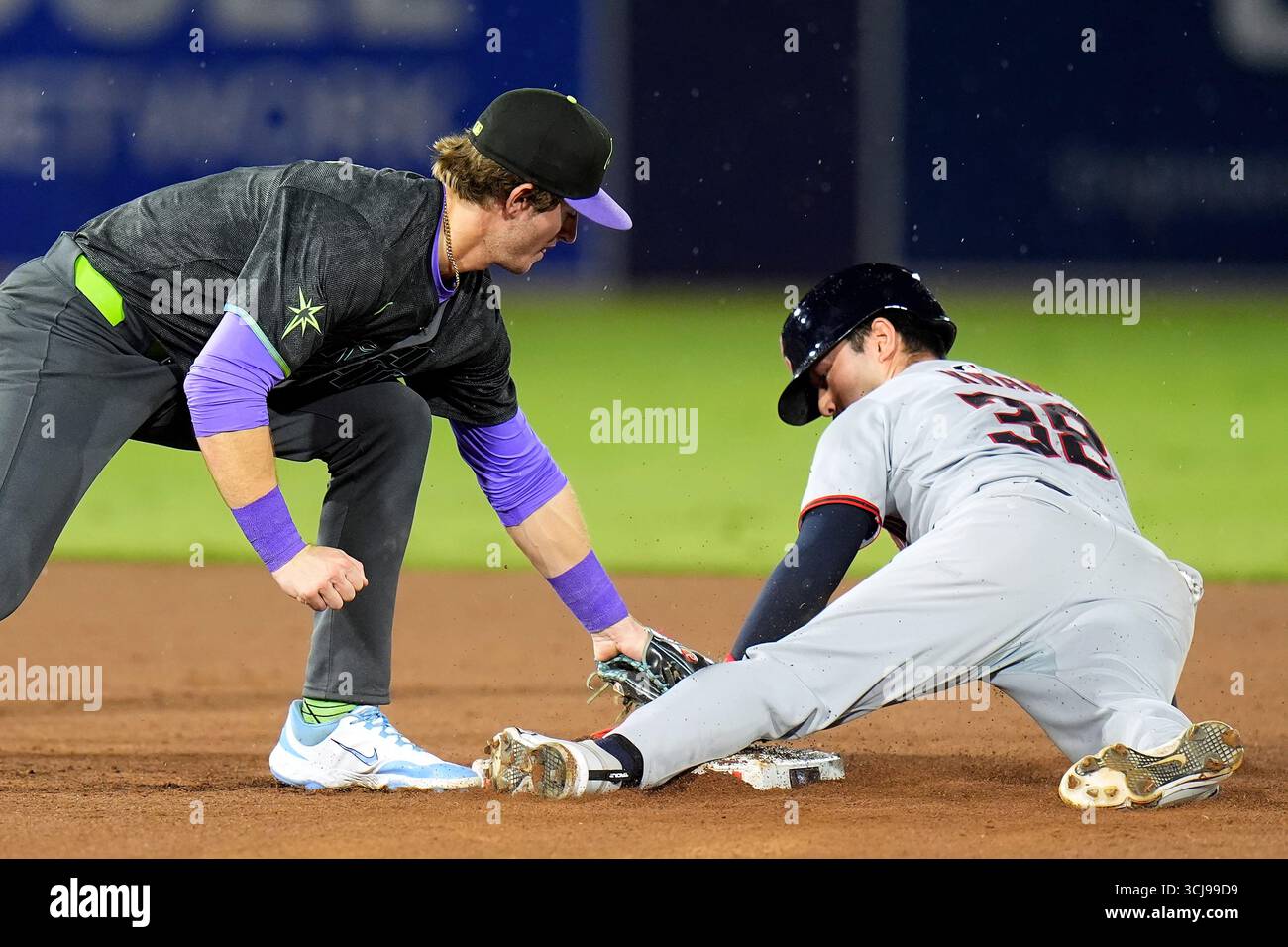Cleveland Guardians' Steven Kwan (38) steals second base ahead of the tag by Tampa Bay Rays ...