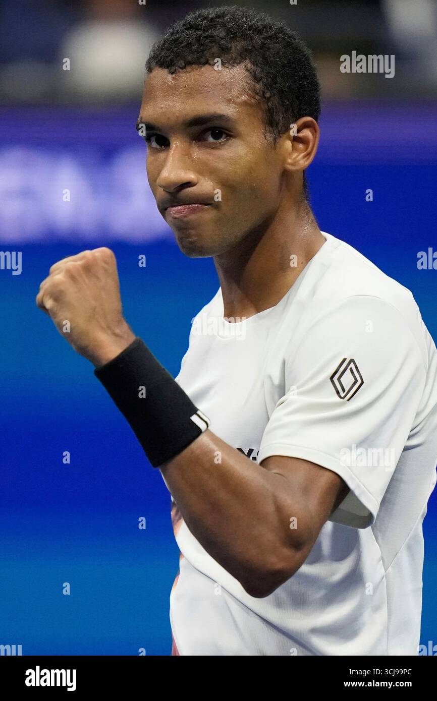 Felix Auger-Aliassime, of Canada, reacts against Jannik Sinner, of ...