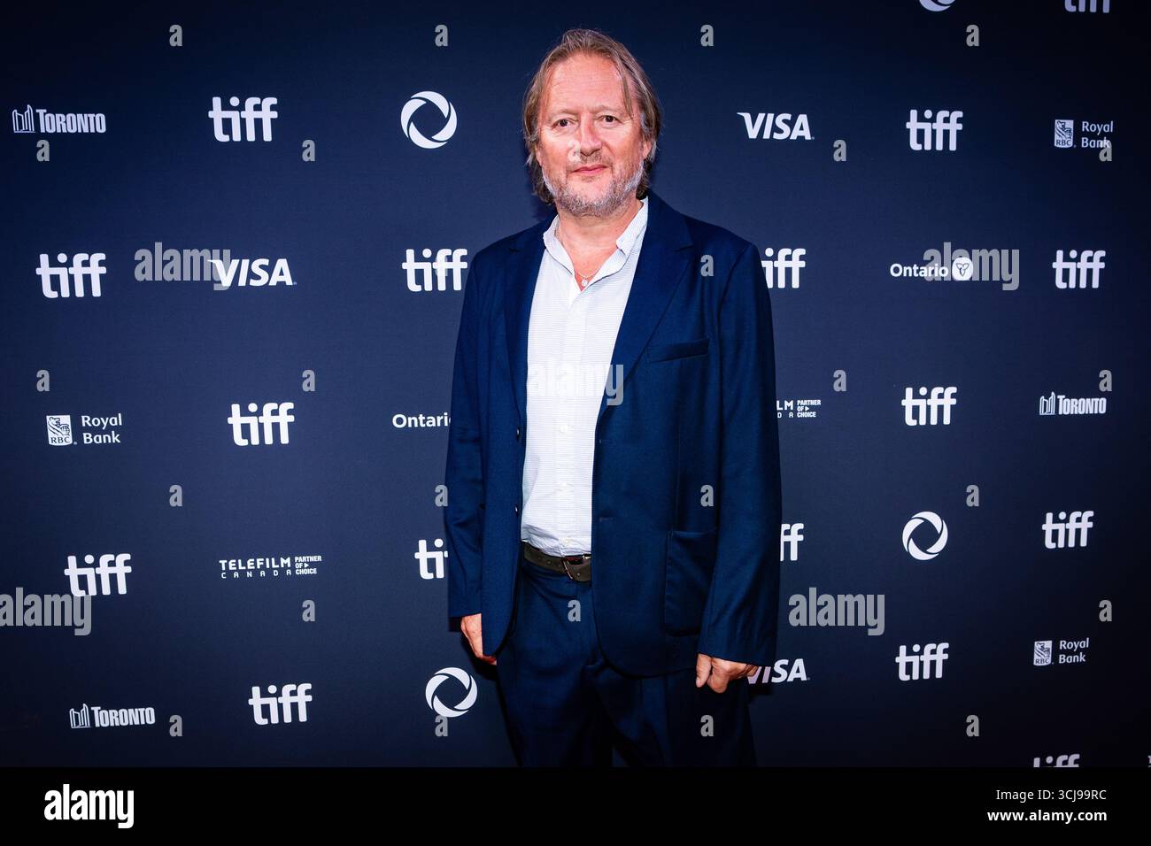 Director David Mackenzie walks the red carpet at the premiere of "Fuze ...