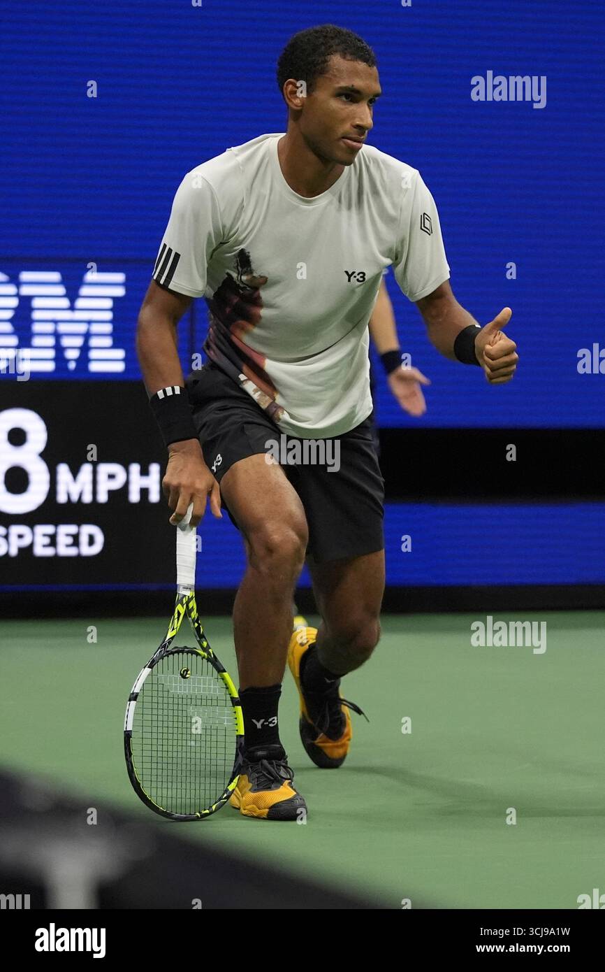 Felix Auger-Aliassime, of Canada, gives a thumbs up after a fall against Jannik Sinner, of Italy ...