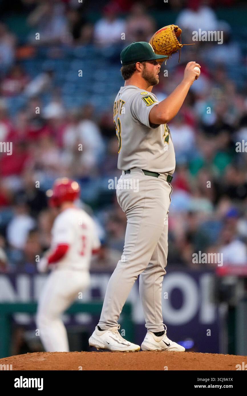 Athletics pitcher Mason Barnett, right, stands on the mound after ...