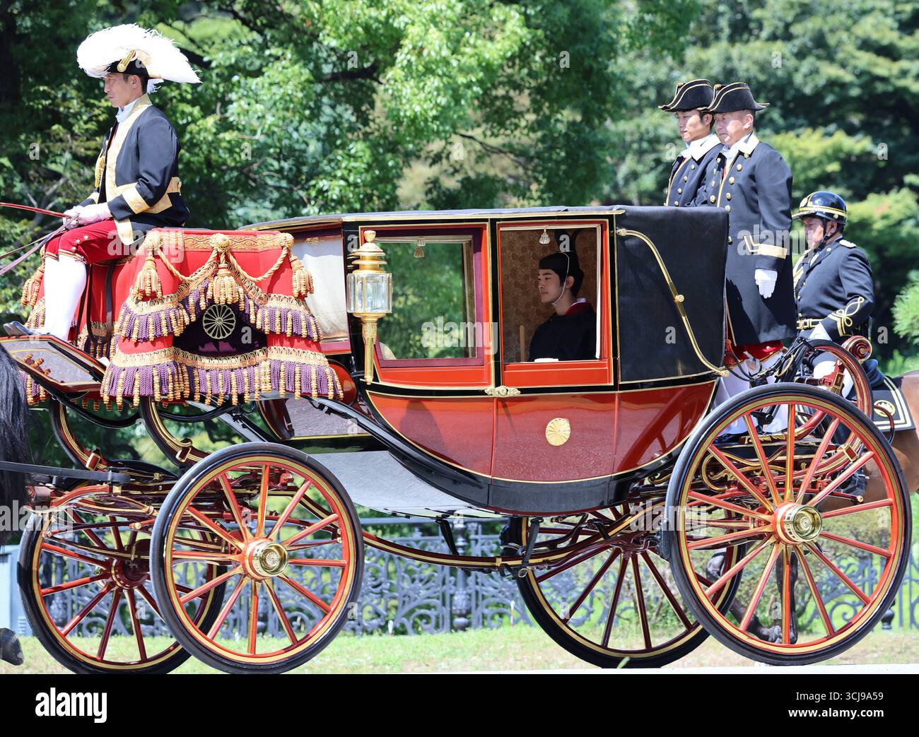 Prince Hisahiro rides in the ceremonial horse-drawn carriage and heads ...