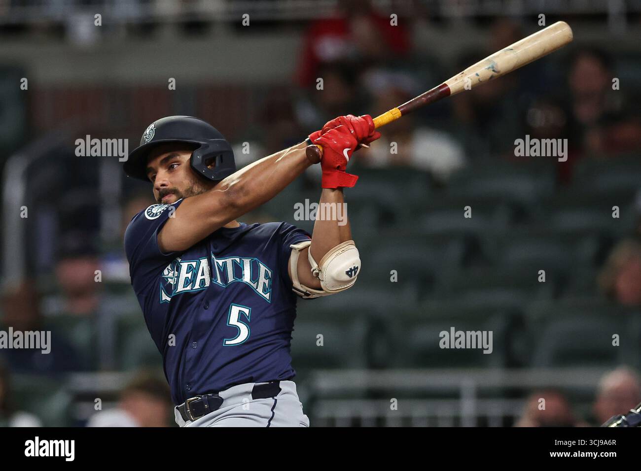Seattle Mariners' Harry Ford (5) swings at a pitch during his MLB debut ...