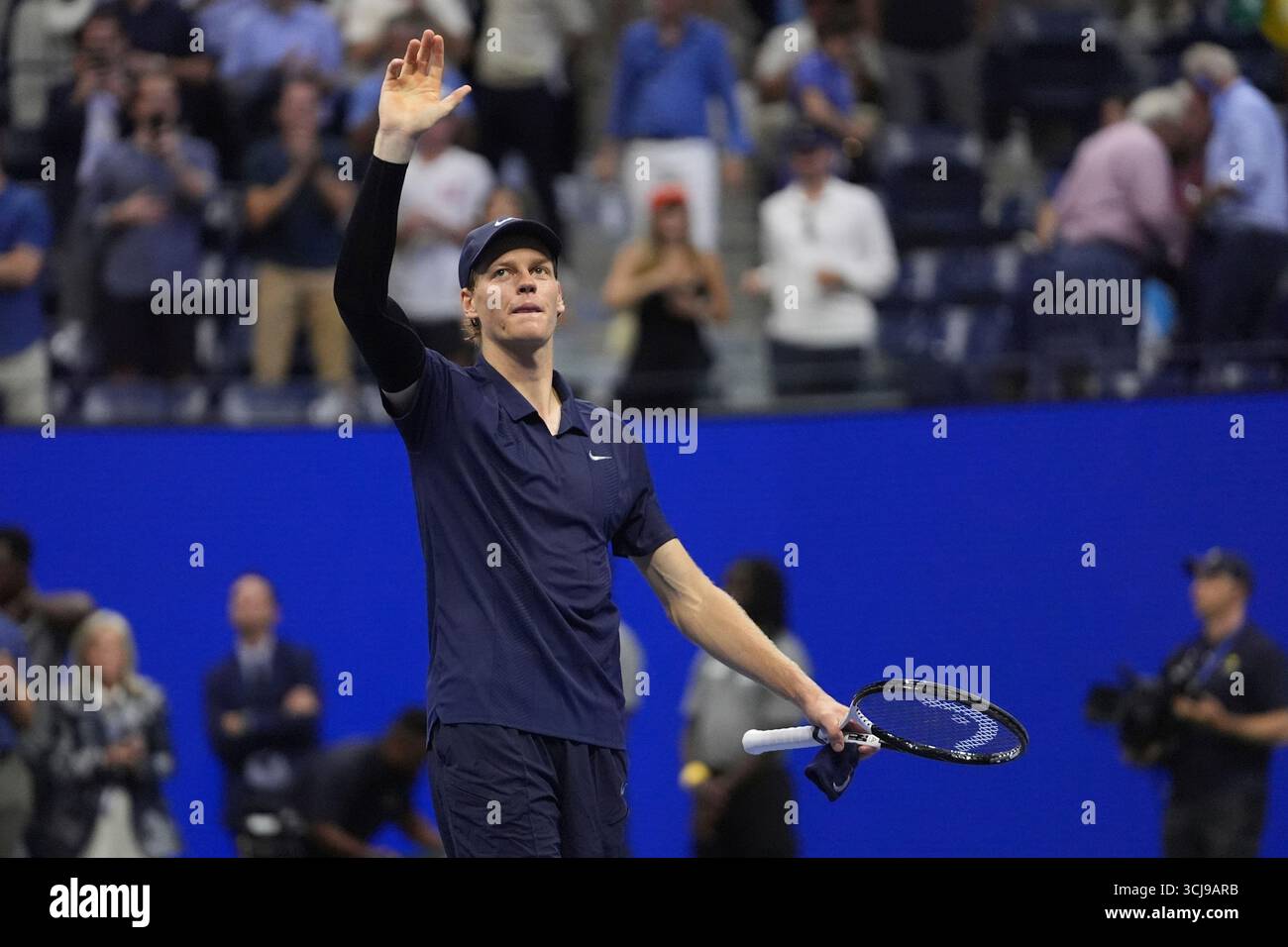 Jannik Sinner, of Italy, waves after defeating Felix Auger-Aliassime ...