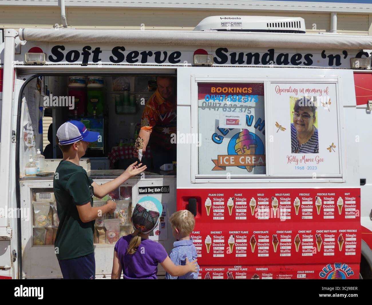 Gee Whiz ice cream van operator Ruskin Gee serves customers at the ...