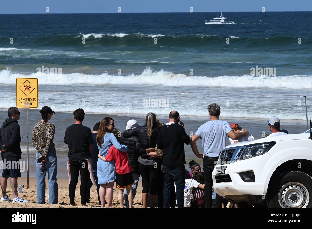 Family and friends father at the scene of a fatal shark attack at Long ...
