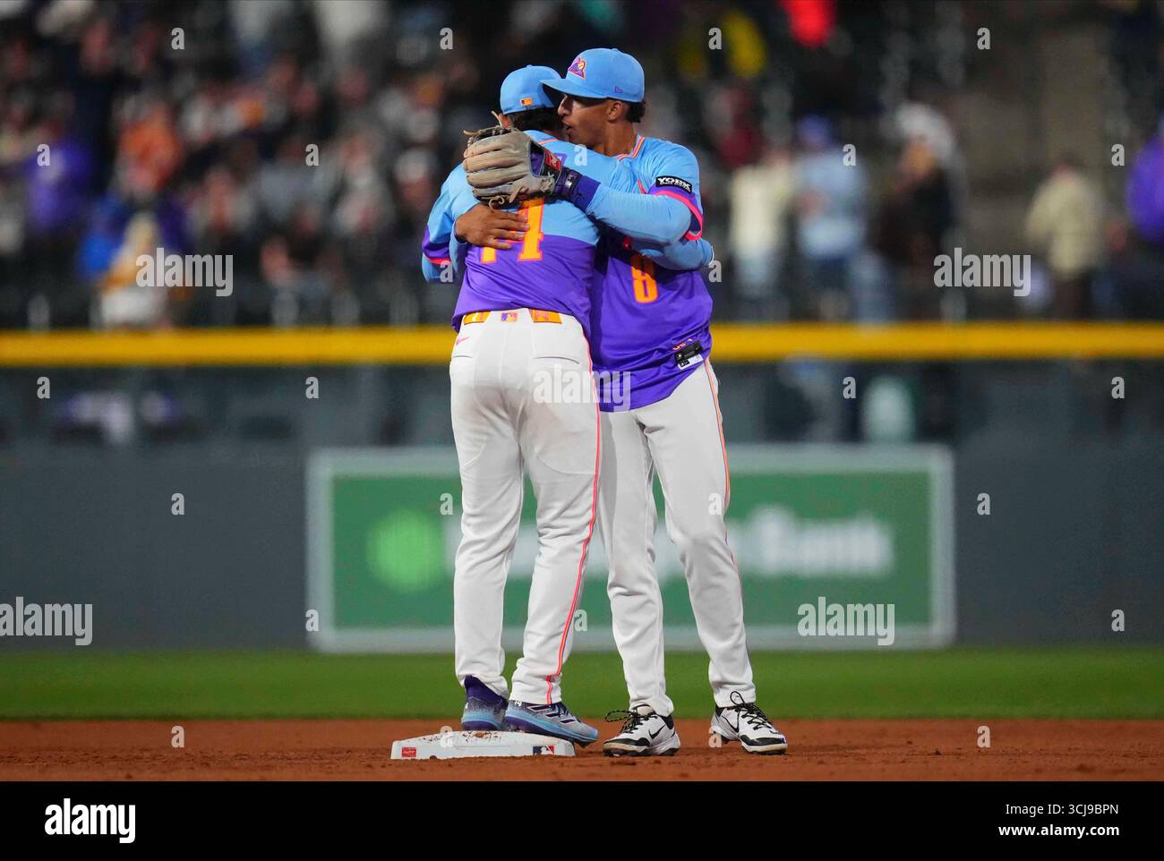Colorado Rockies' Ryan Ritter (8) hugs Ezequiel Tovar, left, after a ...