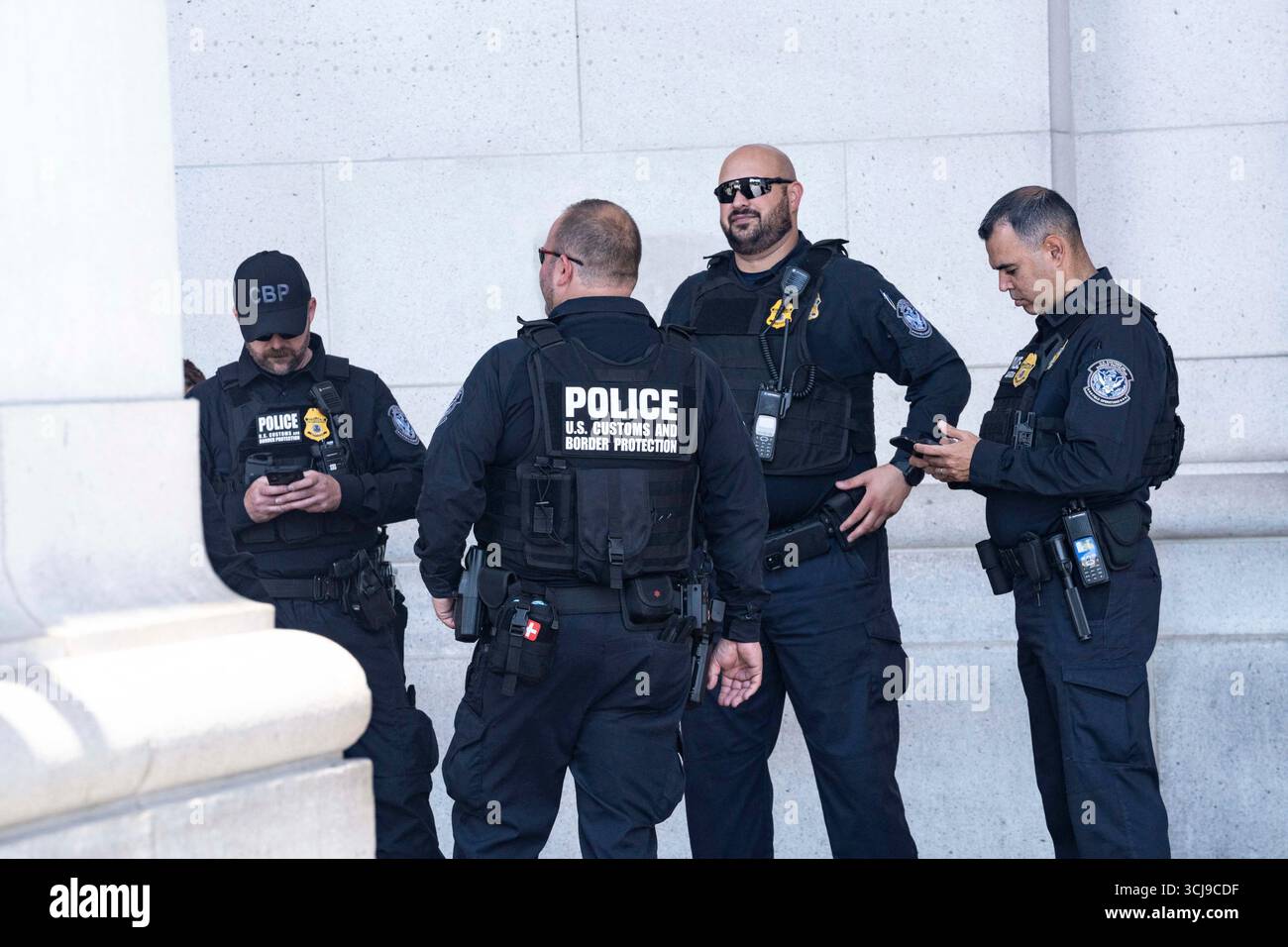 Members of the United States Customs and Border Protection Police stand ...