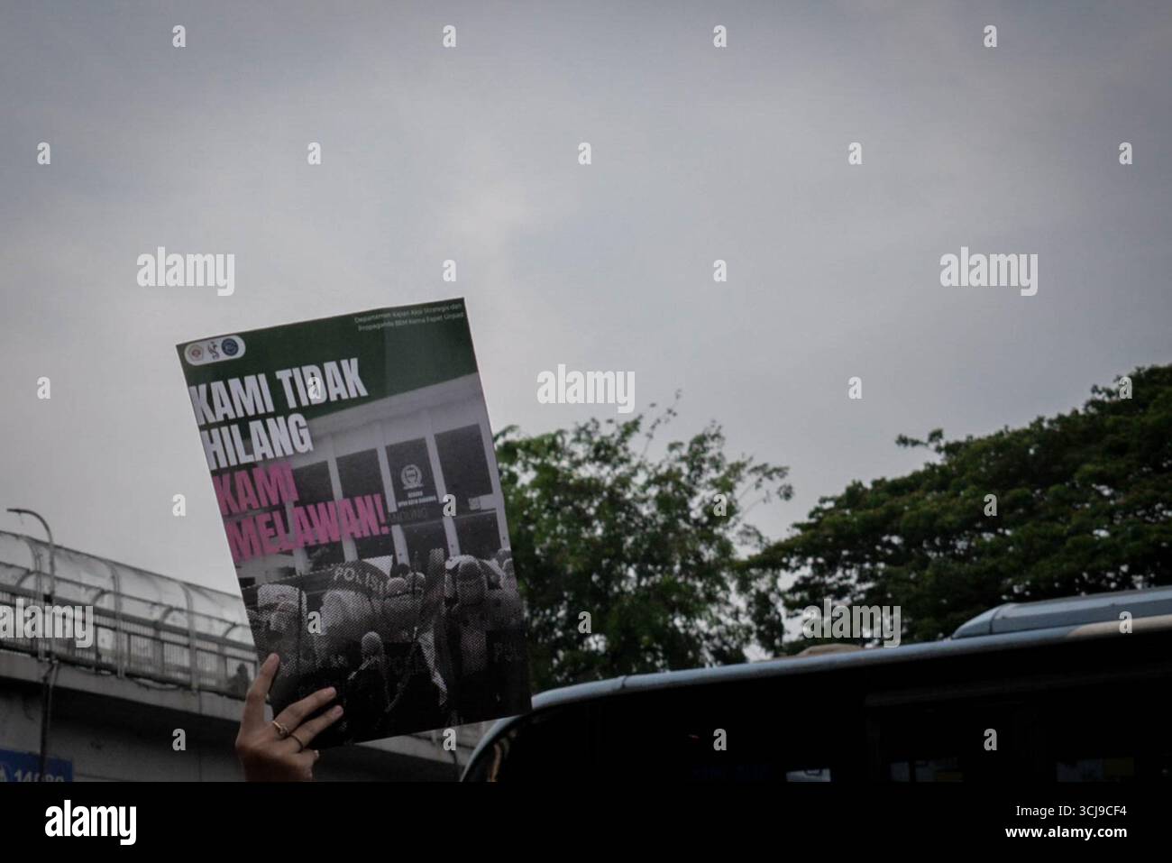 University students carry posters containing protest messages during ...