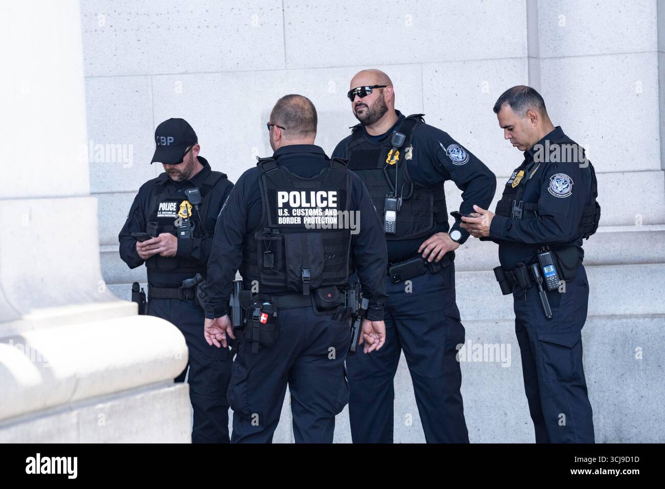Members of the United States Customs and Border Protection Police stand ...
