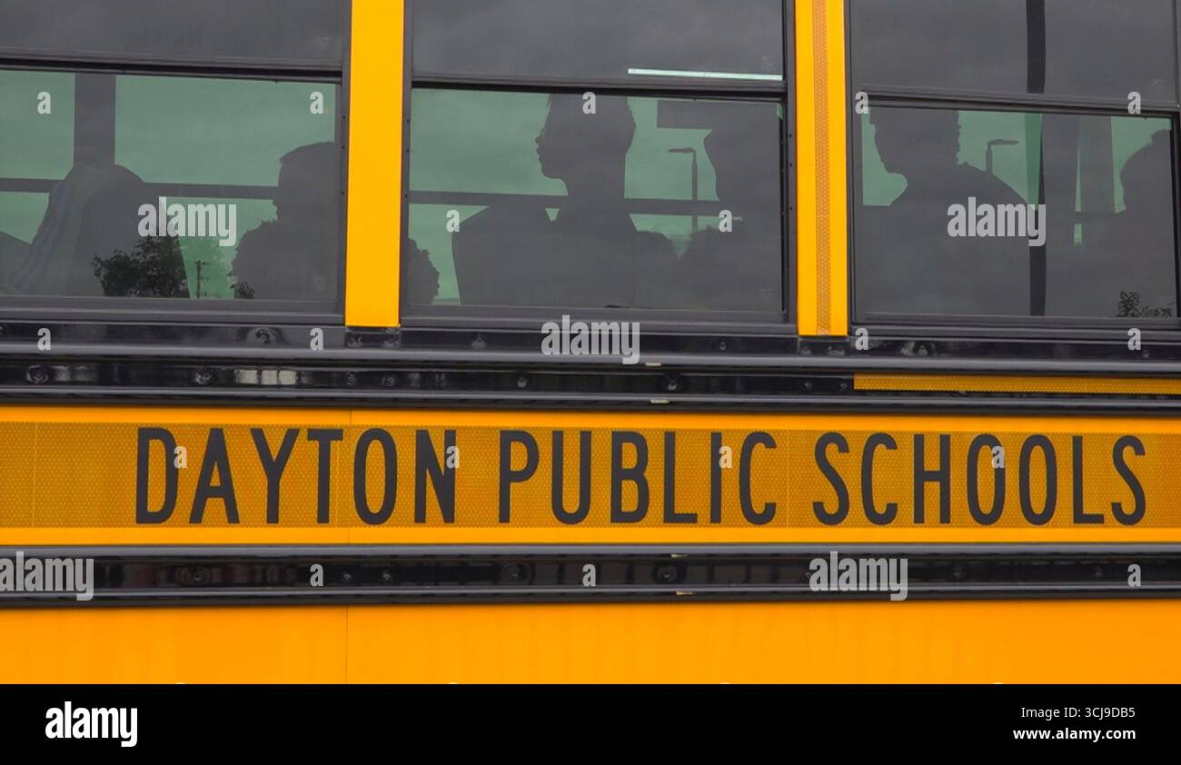 This video taken from photos shows students boarding a school bus on ...