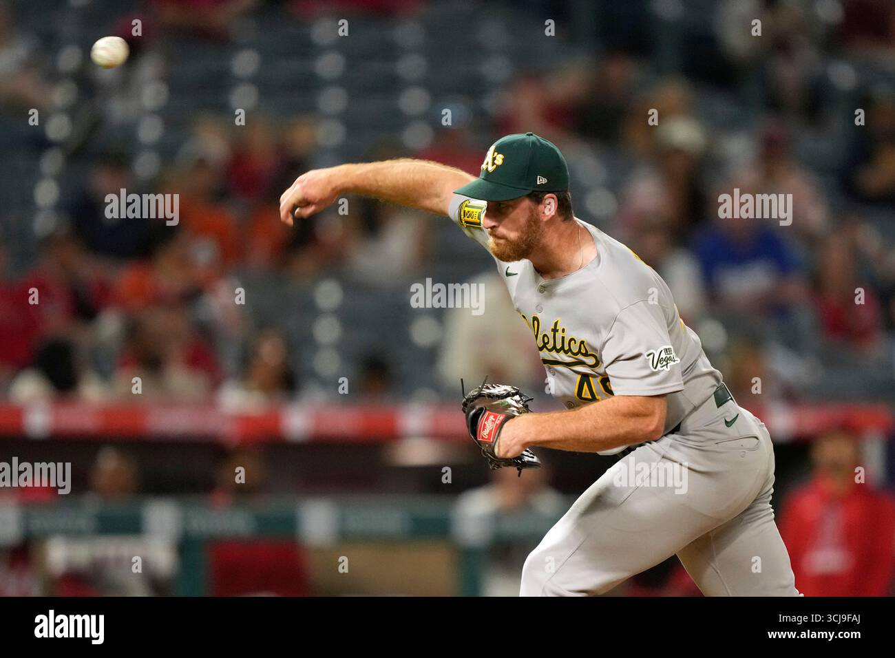 Athletics pitcher Michael Kelly throws to the plate during the ninth ...