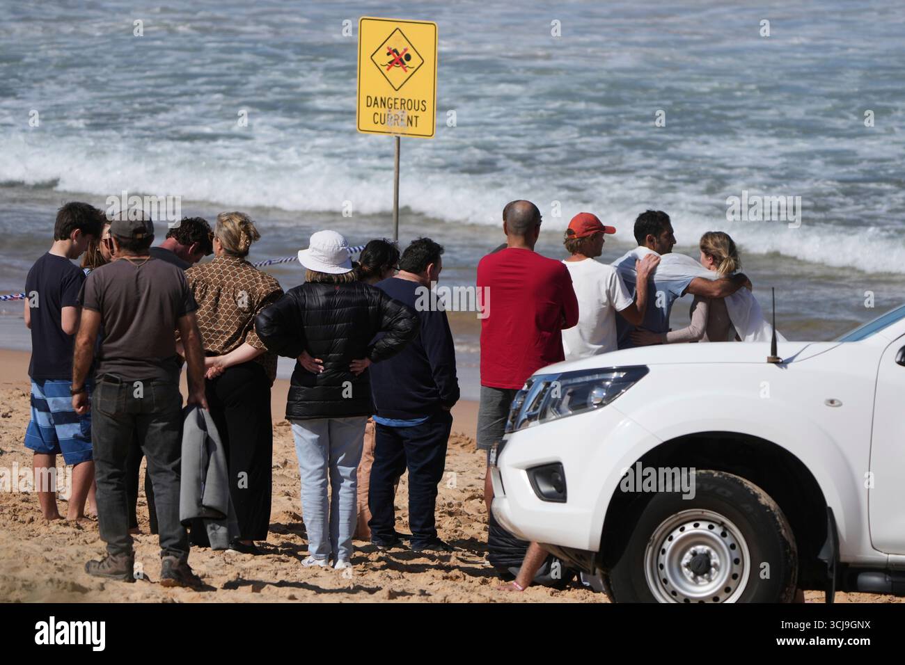 People gather at the site of a fatal shark attack at Dee Why Beach in ...