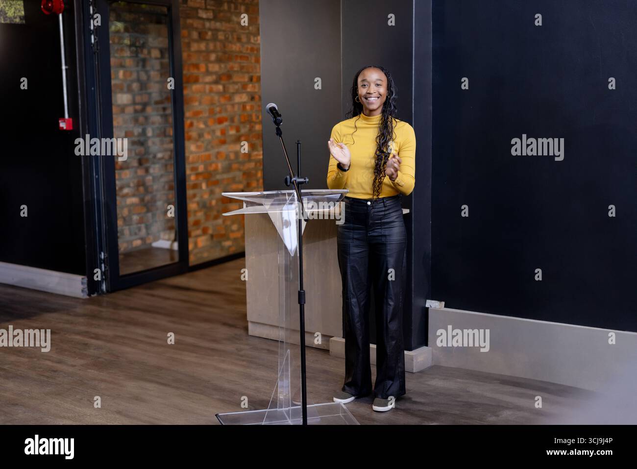Business woman standing behind lectern hi-res stock photography and ...