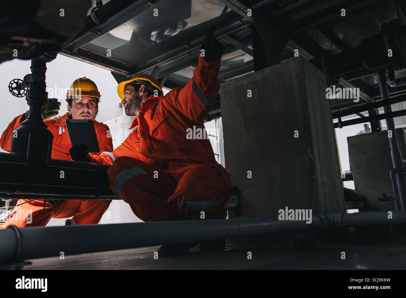 Two professional engineer male teamwork service maintenance, Worker ...