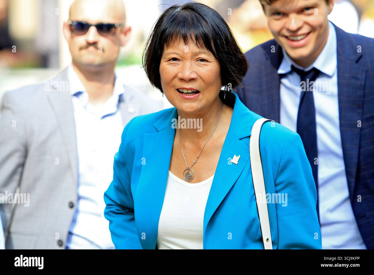 Toronto mayor Olivia Chow walks along King Street as she heads to an ...