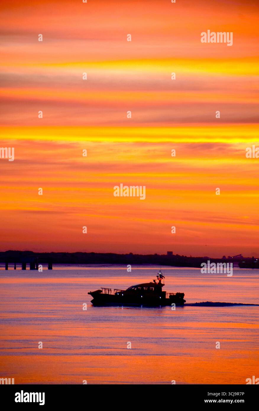 A spectacular sunrise above the River Thames near Gravesend in Kent ...