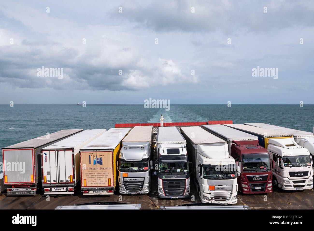 Harwich, UK 31.08.25. semi trucks parked on ferry ship crossing ...