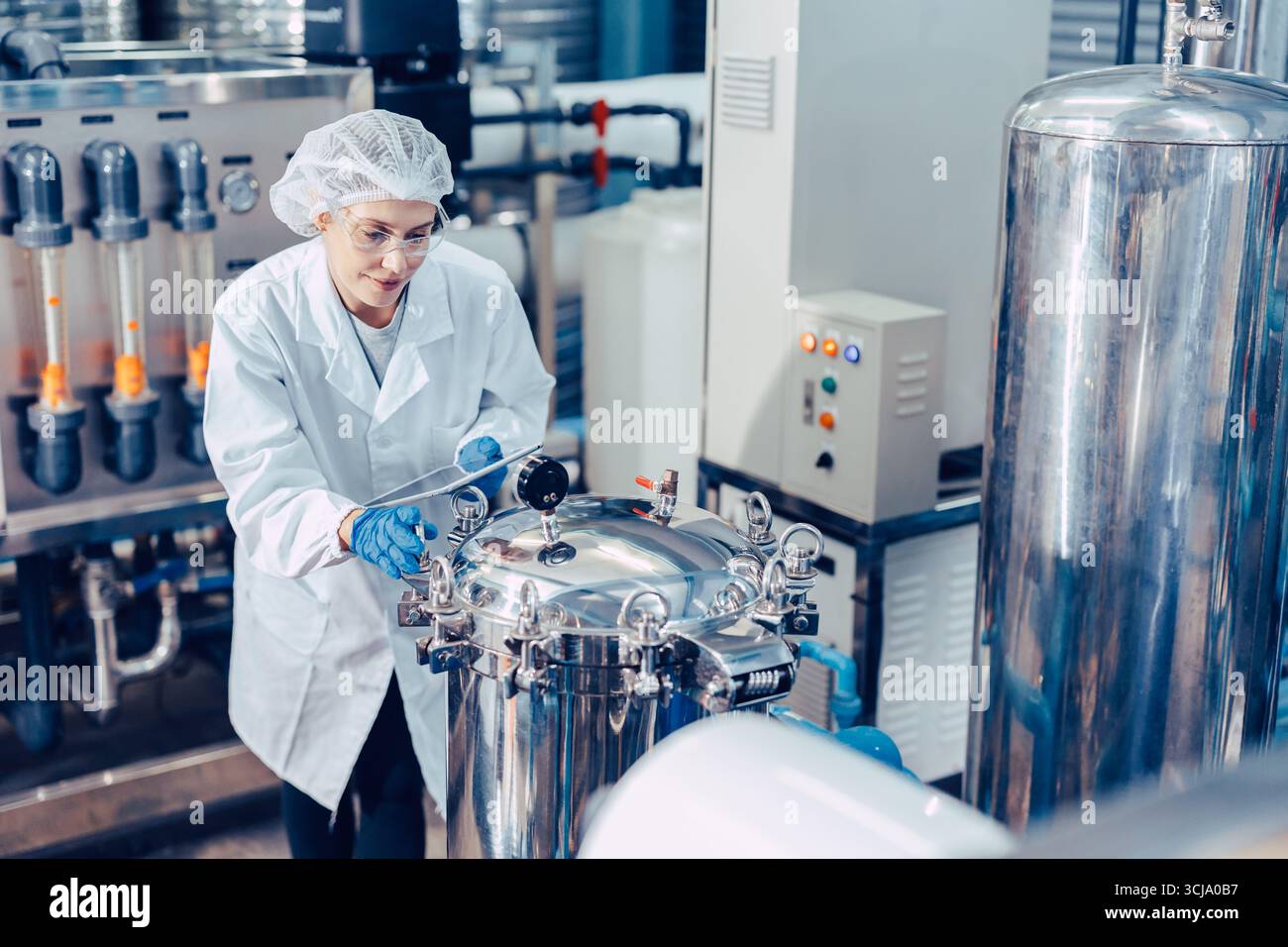 staff work in science medical lab factory check record pressure tank ...