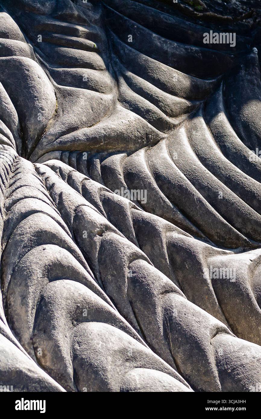 Unique textures and patterns formed on a stone surface show the effects ...