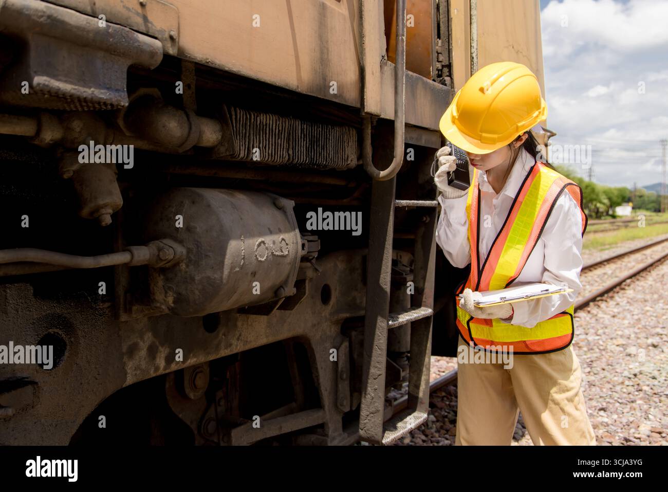 Asian young teen engineer worker work in Train station, Old locomotive ...