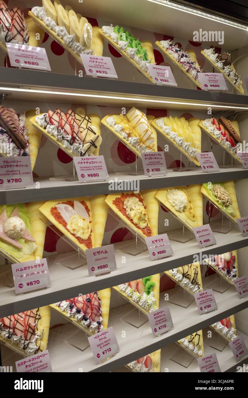 Plastic display specimens in the window of a shop for Japanese crepes ...