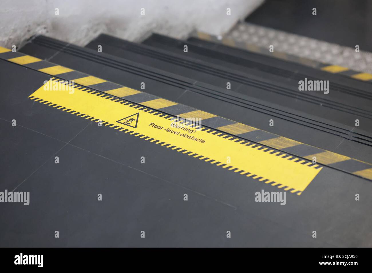 Warning strips for uneven areas to prevent accidents. Yellow and black ...