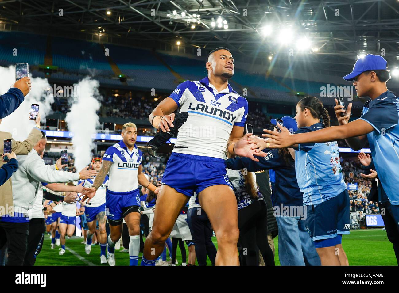 Stephen Crichton of the Bulldogs leads his team out for the first half ...