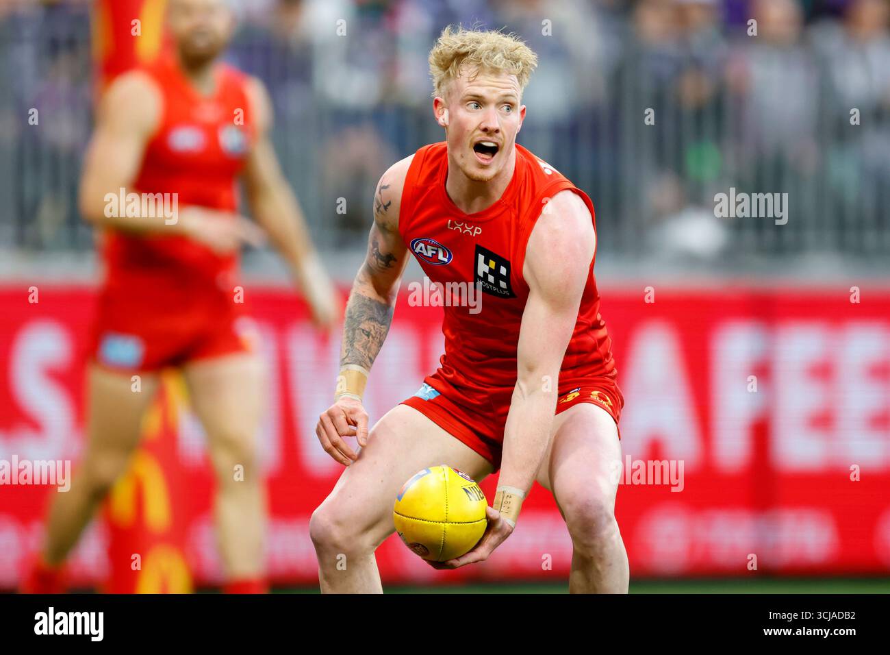 John Noble of the Suns looks to handball during the AFL Elimination ...